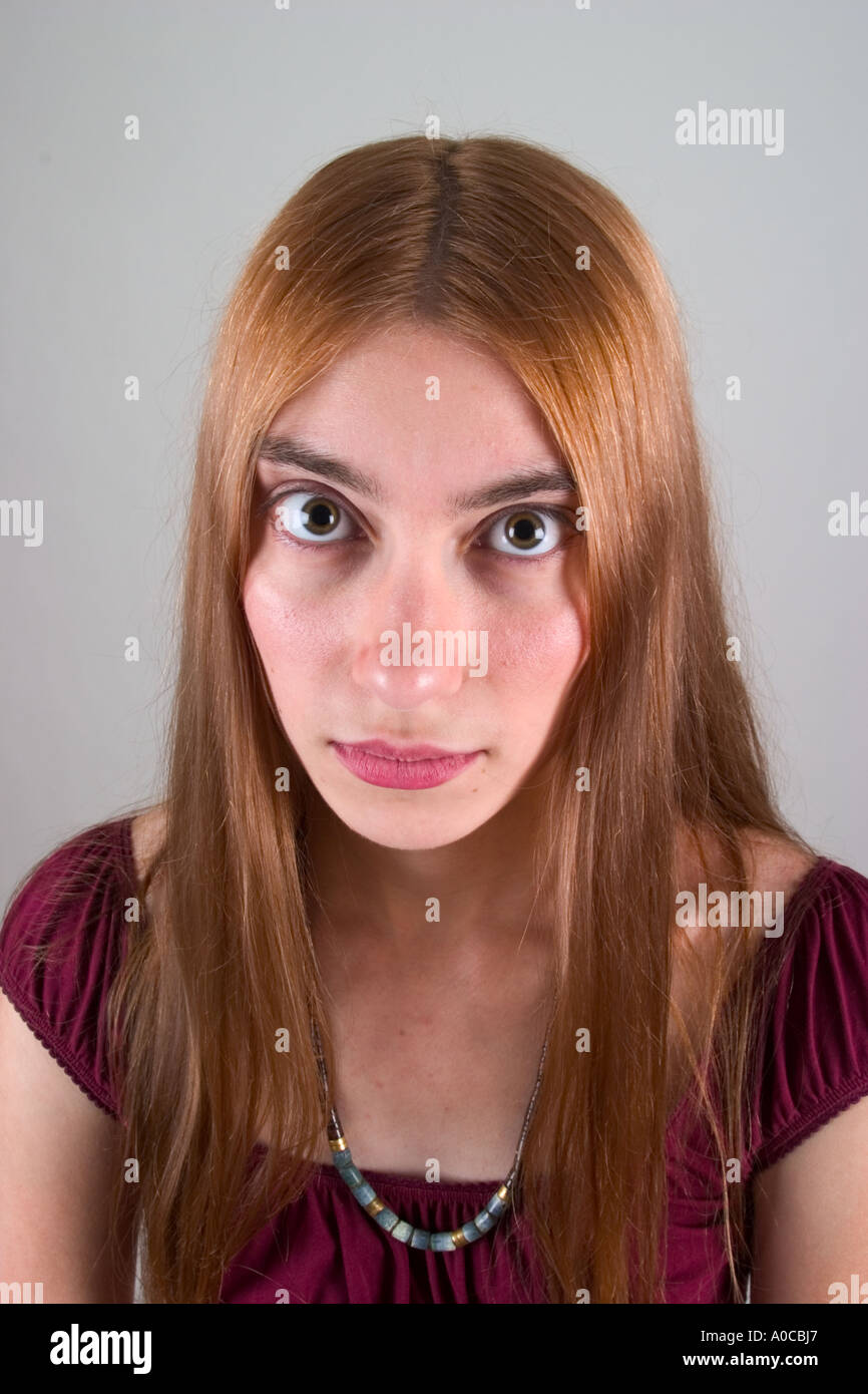 Young woman with long red hair posing Model Released Stock Photo - Alamy