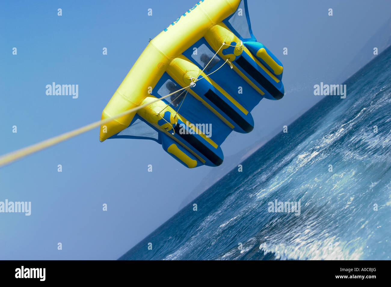 fun in riding an inflatable boat pulled by an outboard motor Stock ...