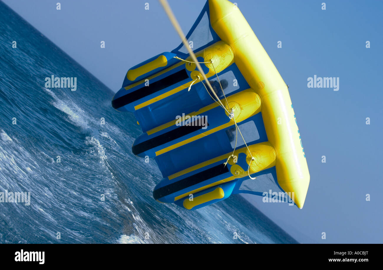 fun in riding an inflatable boat pulled by an outboard motor Stock ...