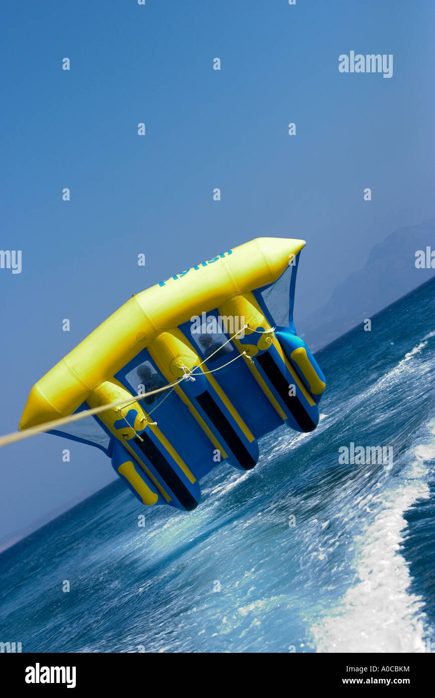 fun in riding an inflatable boat pulled by an outboard motor Stock ...