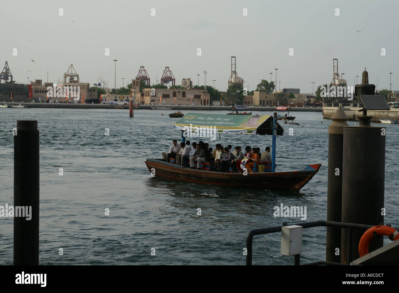 Passenger craft ferrying people across the creek in Dubai Stock Photo ...