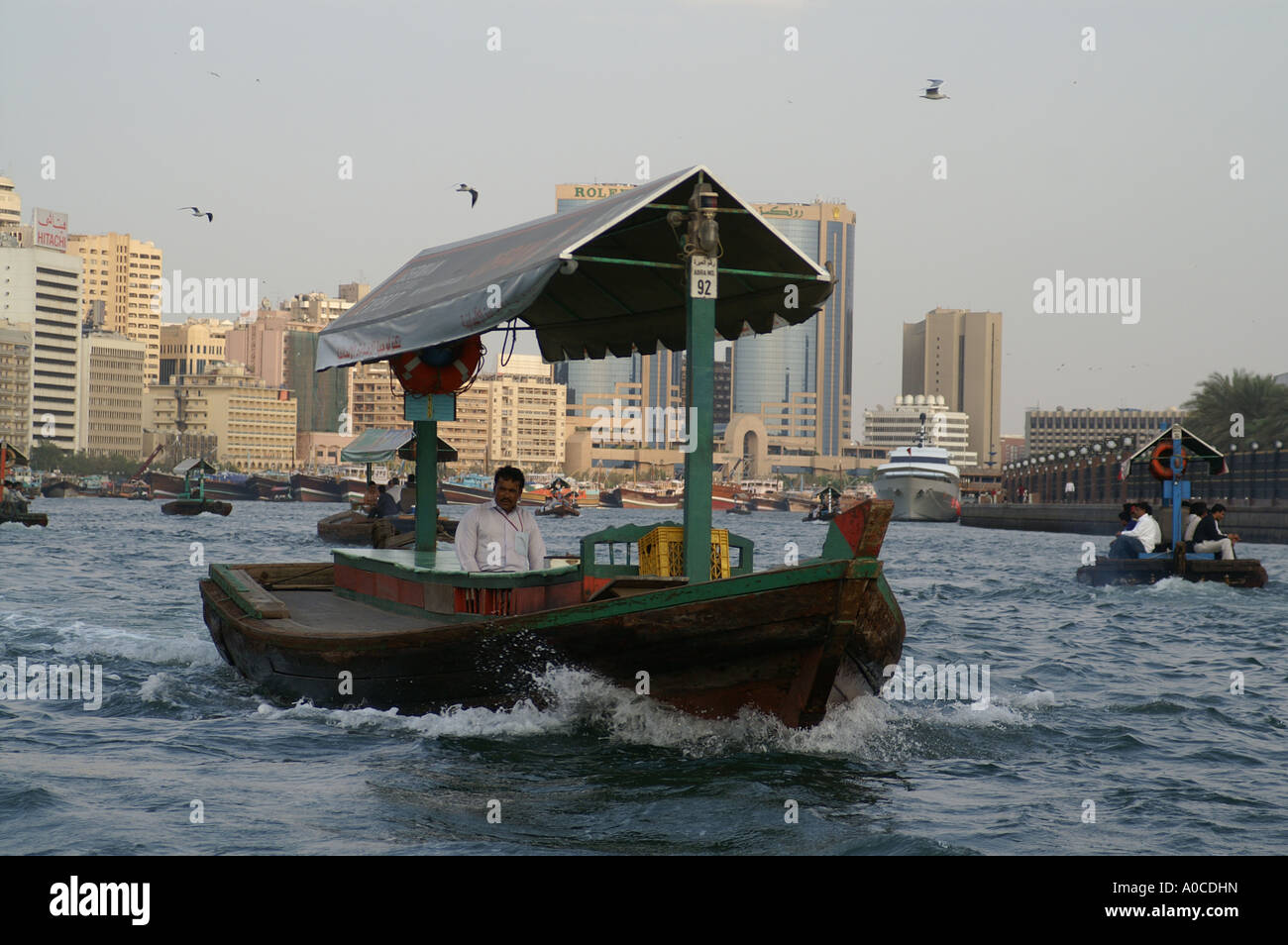 Passenger craft ferrying people across the creek in Dubai Stock Photo ...
