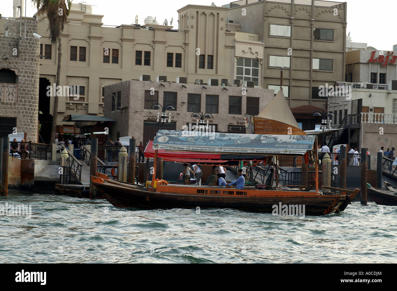 Passenger craft ferrying people across the creek in Dubai Stock Photo ...
