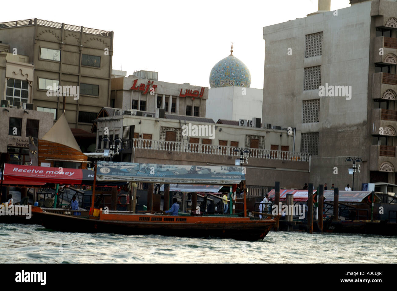 Passenger craft ferrying people across the creek in Dubai Stock Photo ...