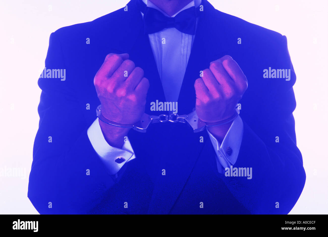 gentleman gangster in handcuffs close up Stock Photo - Alamy