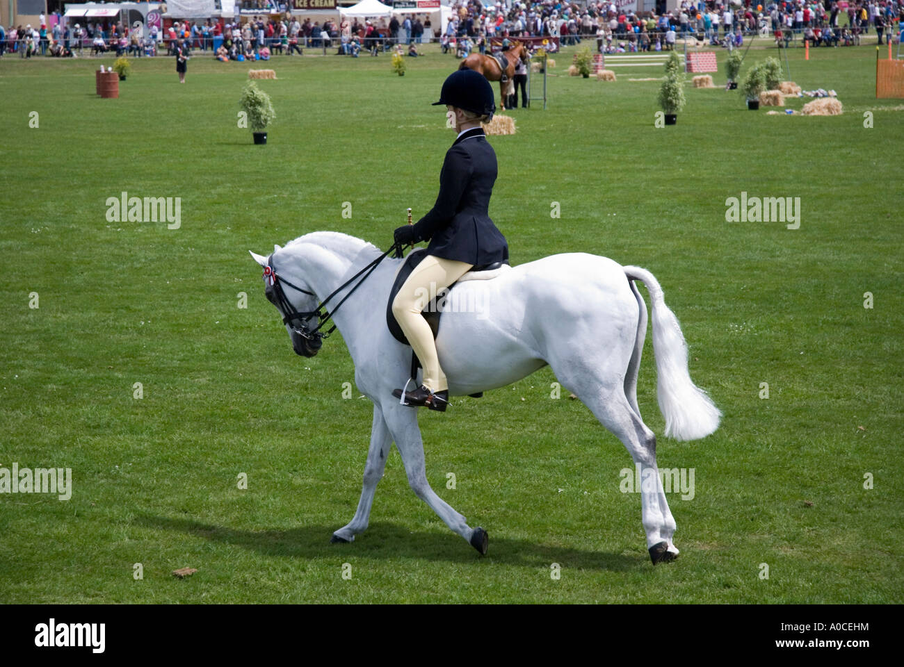 A young girl competing in an equestrian event at an agricultural show ...