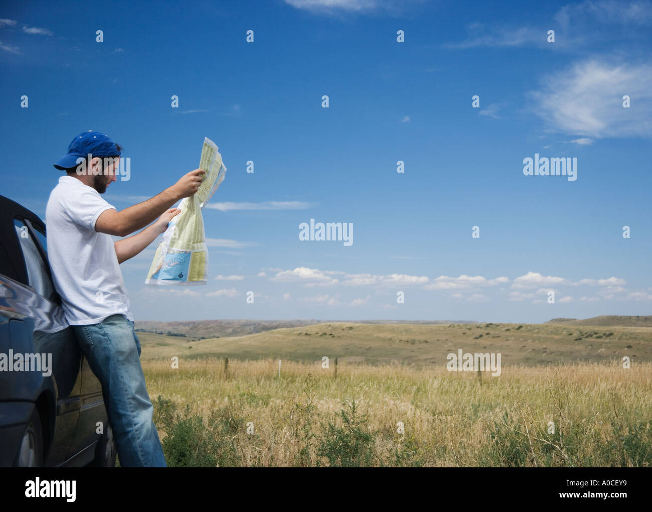Man reading a map outdoors Stock Photo - Alamy