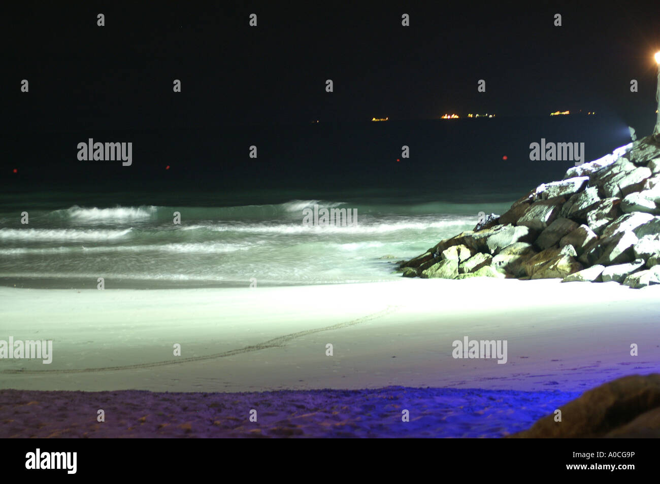 Jumeira beach floodlit in blue at night Dubai Stock Photo - Alamy