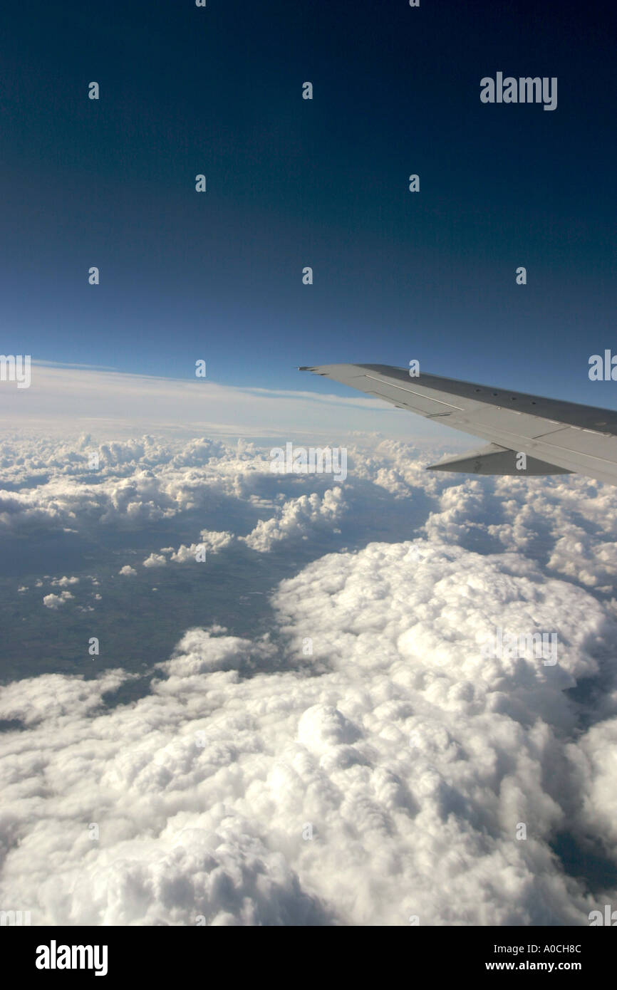 Looking out above the clouds from a plane at 30 000 feet Stock Photo ...