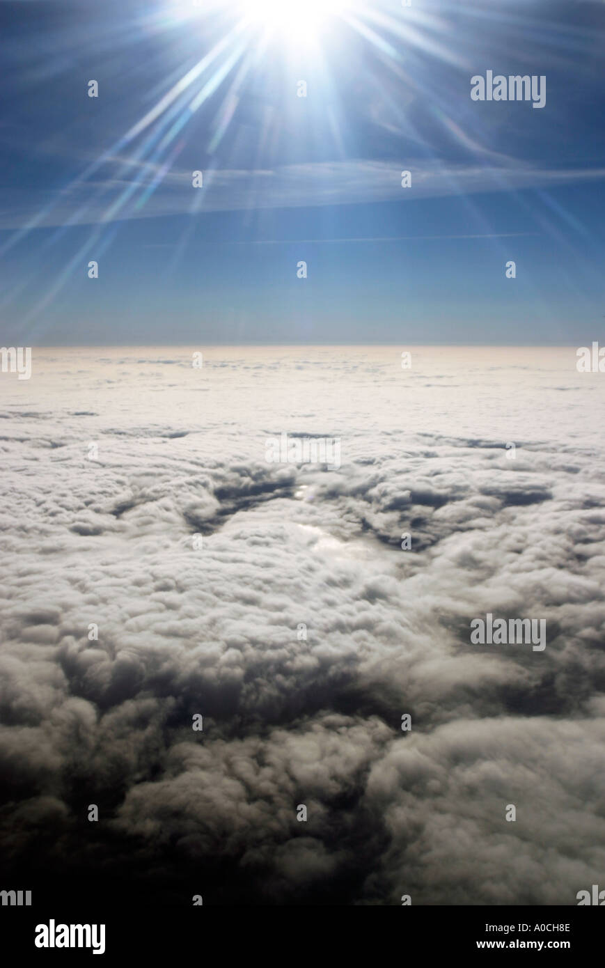 Looking out above the clouds from a plane at 30 000 feet Stock Photo ...