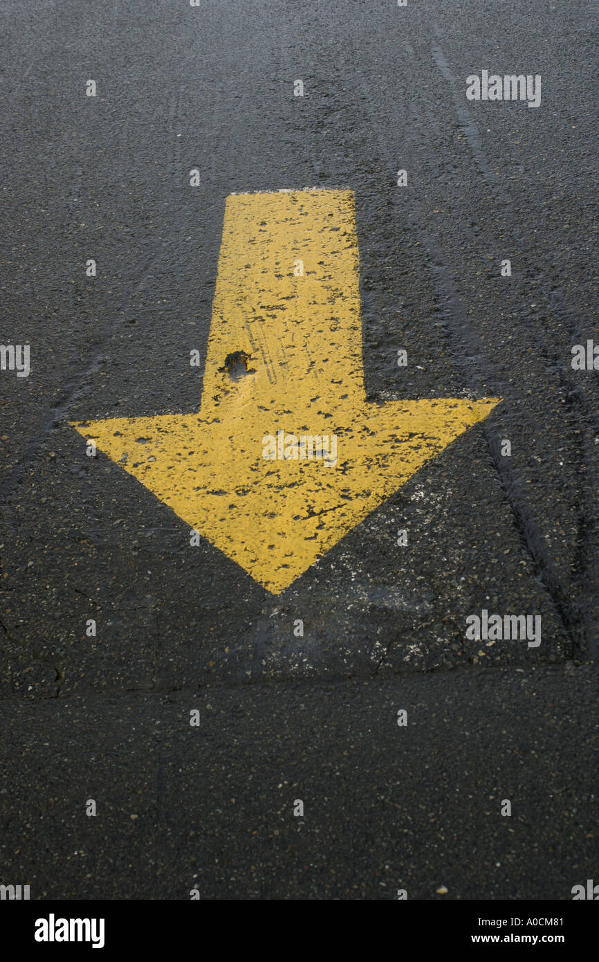 Painted yellow arrow hi-res stock photography and images - Alamy
