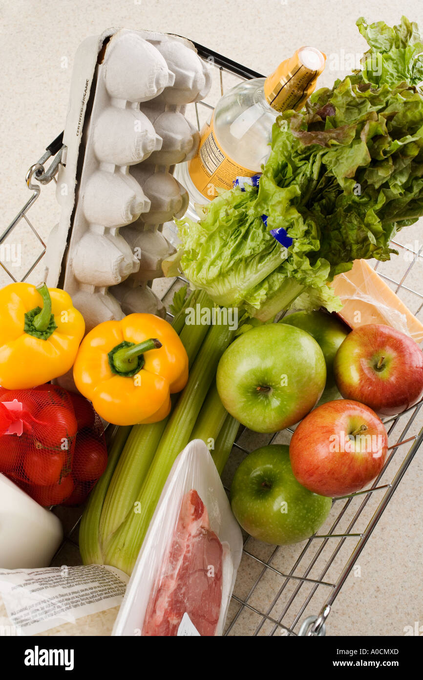 Overhead view of groceries in basket Stock Photo - Alamy
