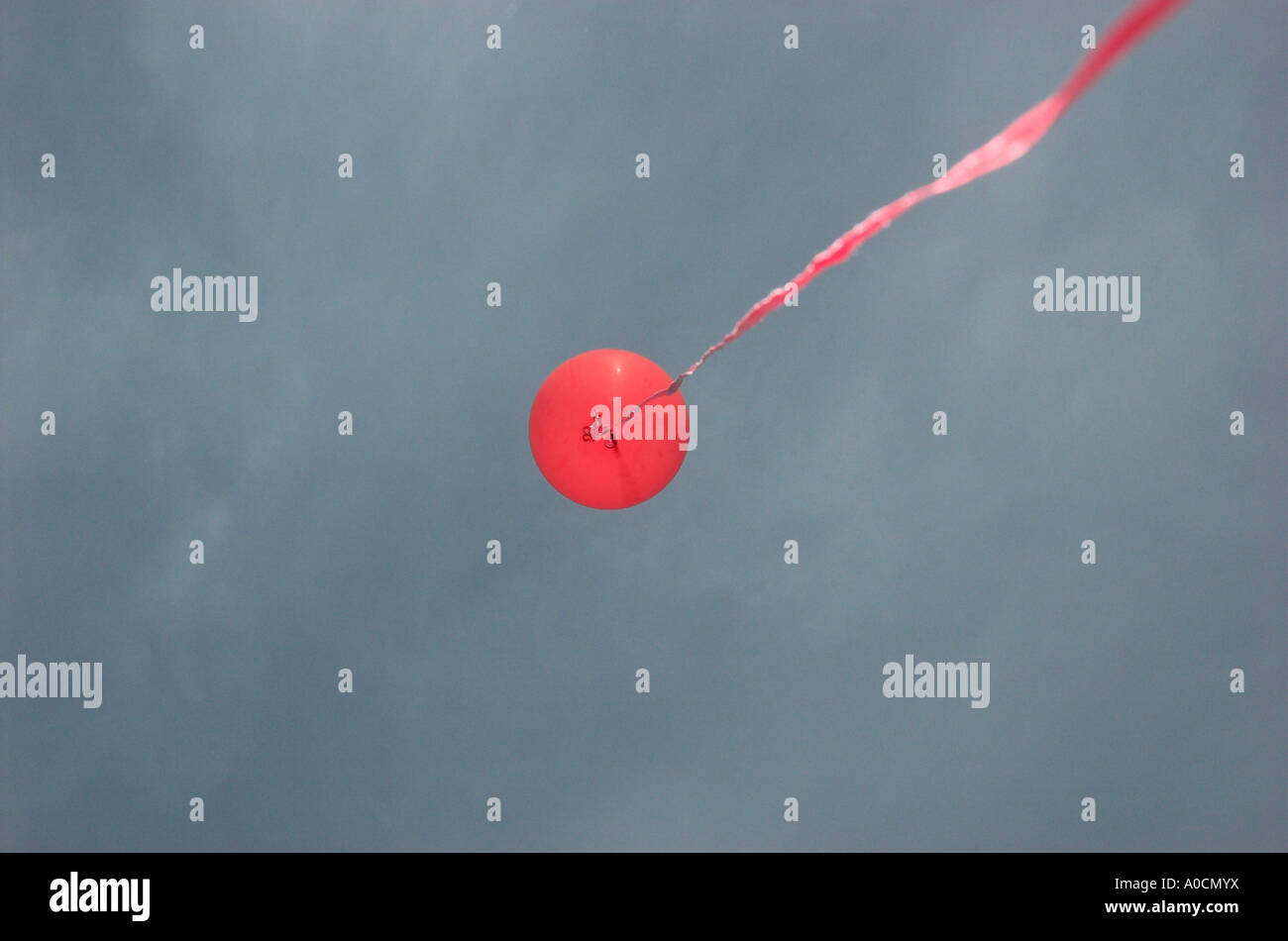 Red Balloon Floating Away Stock Photo - Alamy