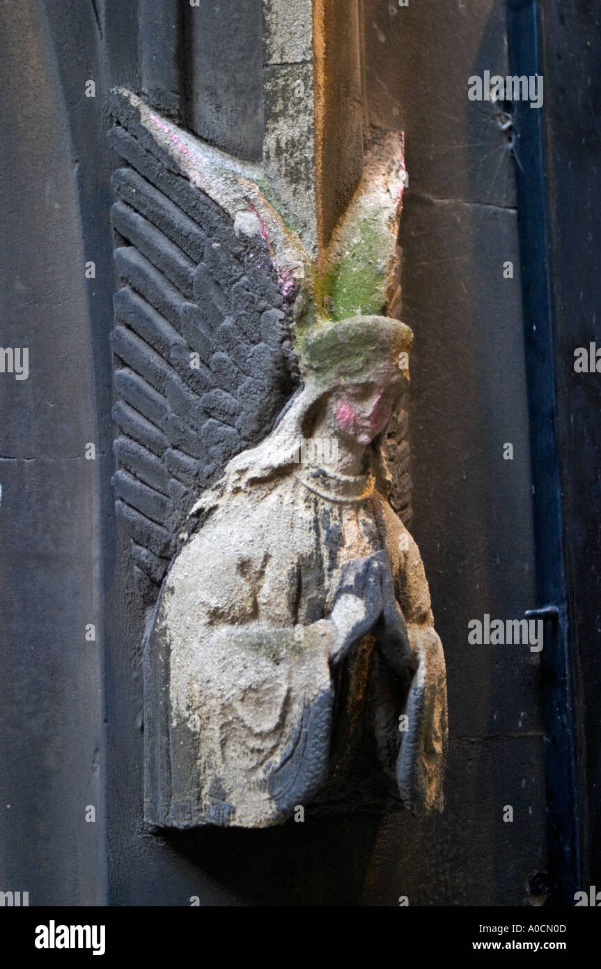 A broken carving of an angel in the alley at the side of All Saints ...