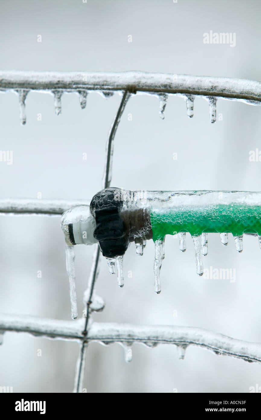 Garden hose on fence with freezing rain Near Alpine Oregon Stock Photo ...