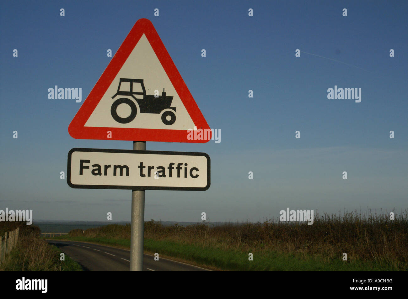 Road sign showing a farm tractor Stock Photo - Alamy