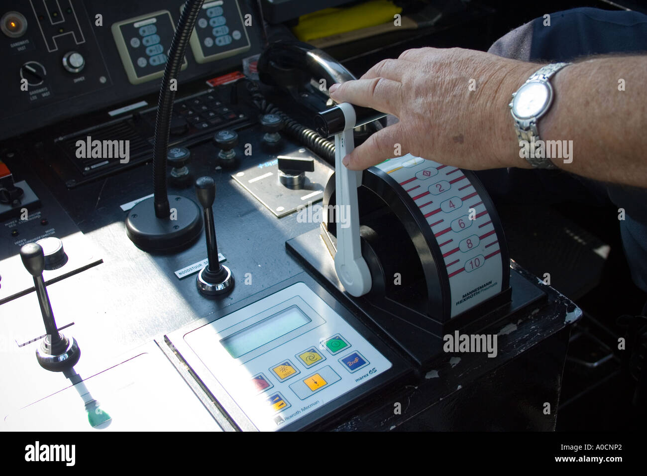 Captain steering his boat Stock Photo - Alamy