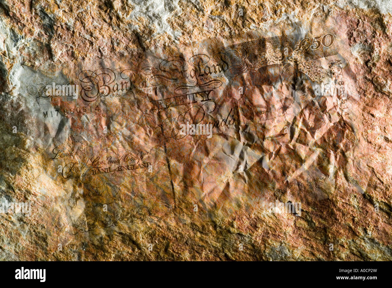 50 fifty pound bank note hidden in rock Stock Photo - Alamy