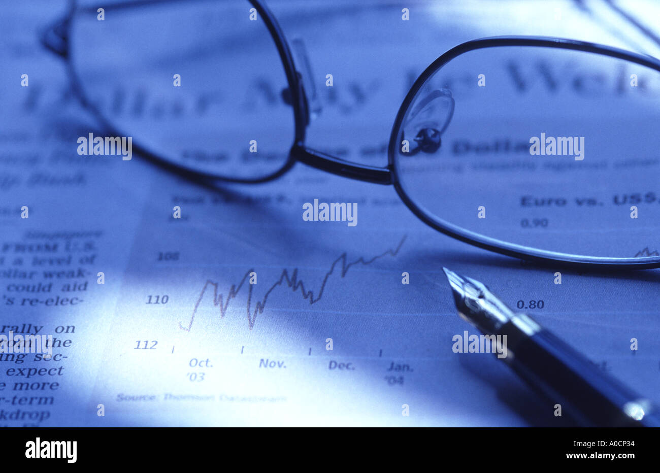 newspaper with glasses on top Stock Photo - Alamy