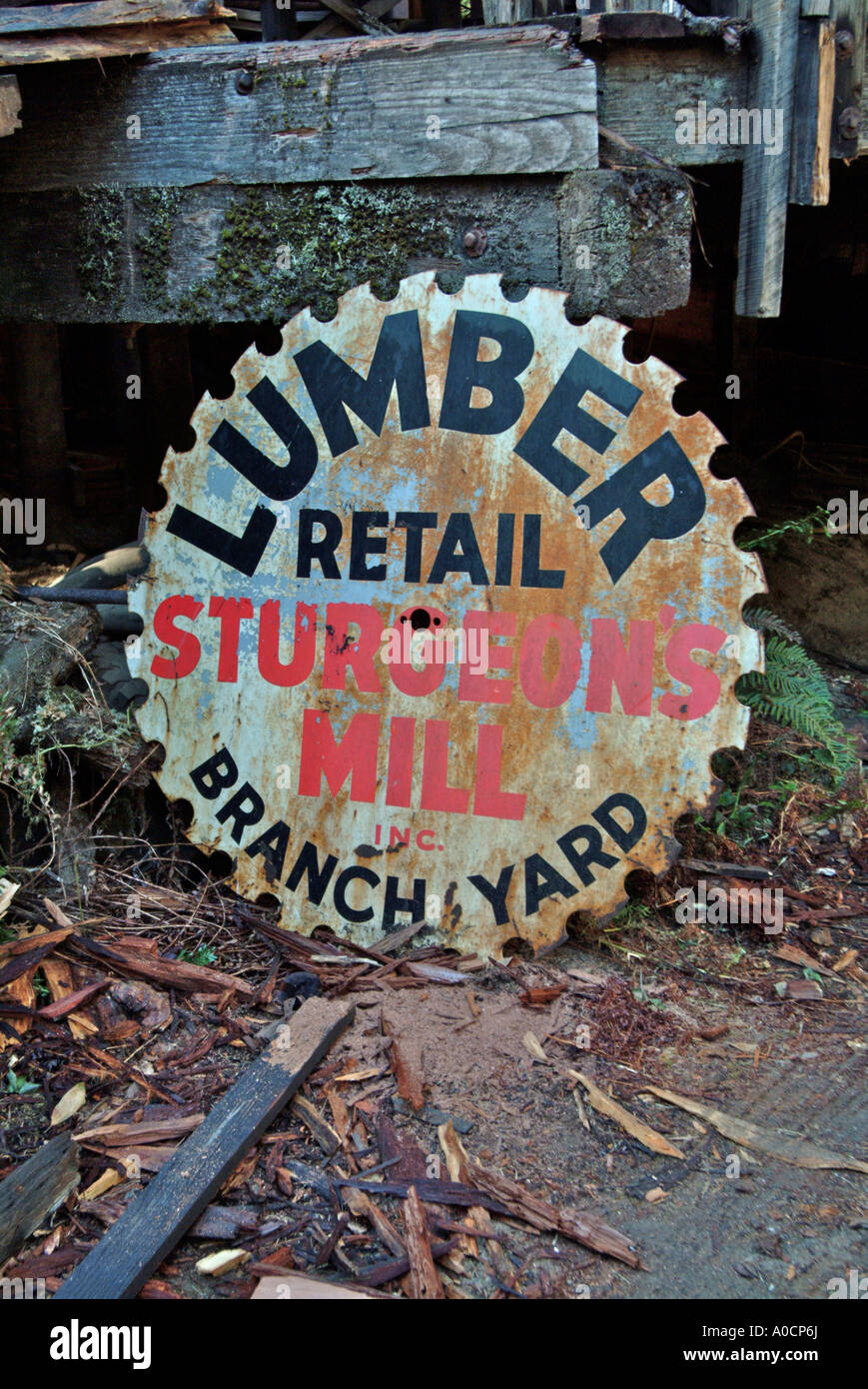 The sign for Sturgeons Mill is painted on an old giant circular saw ...