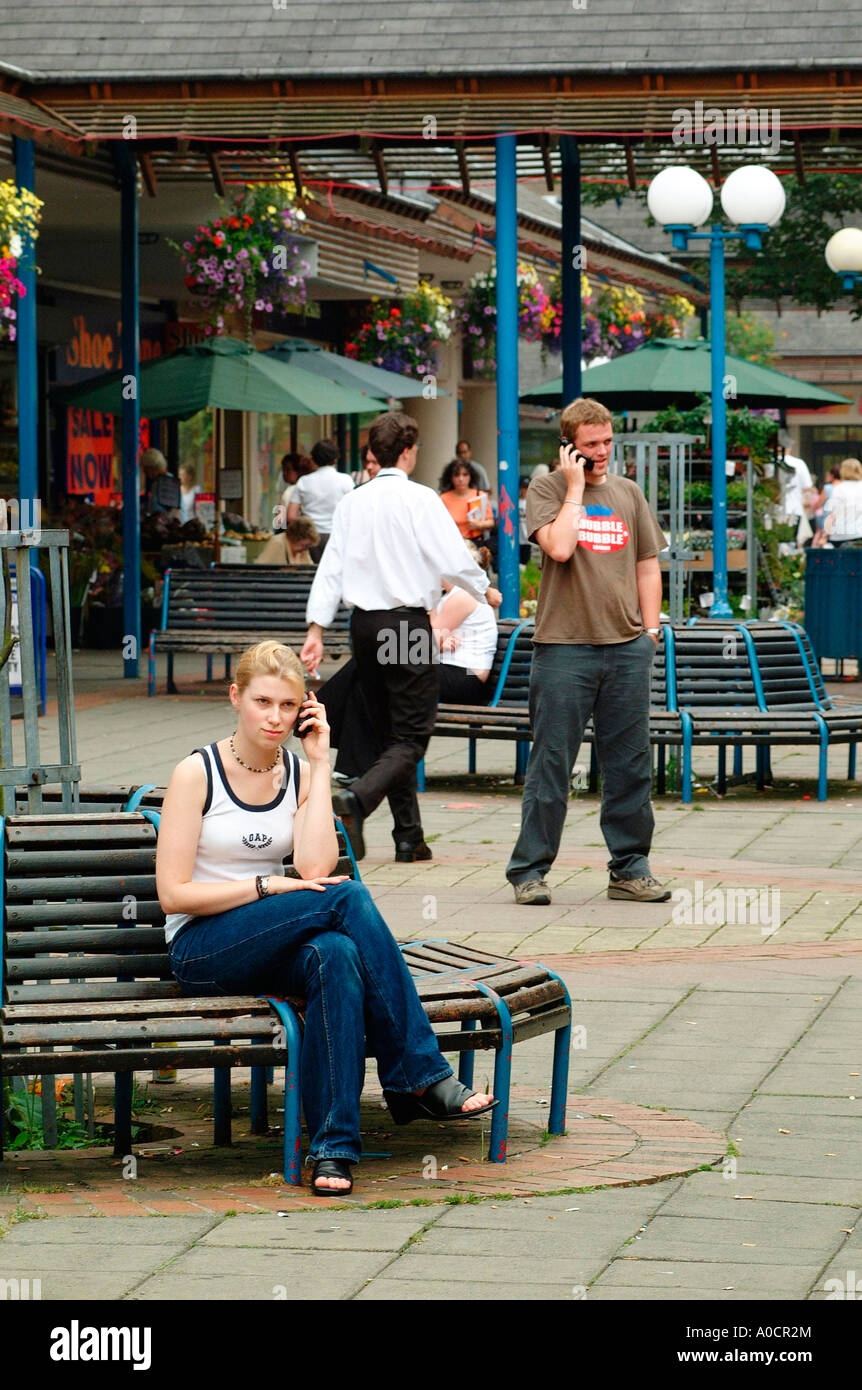 People using mobile phones in a busy street in england Stock Photo - Alamy