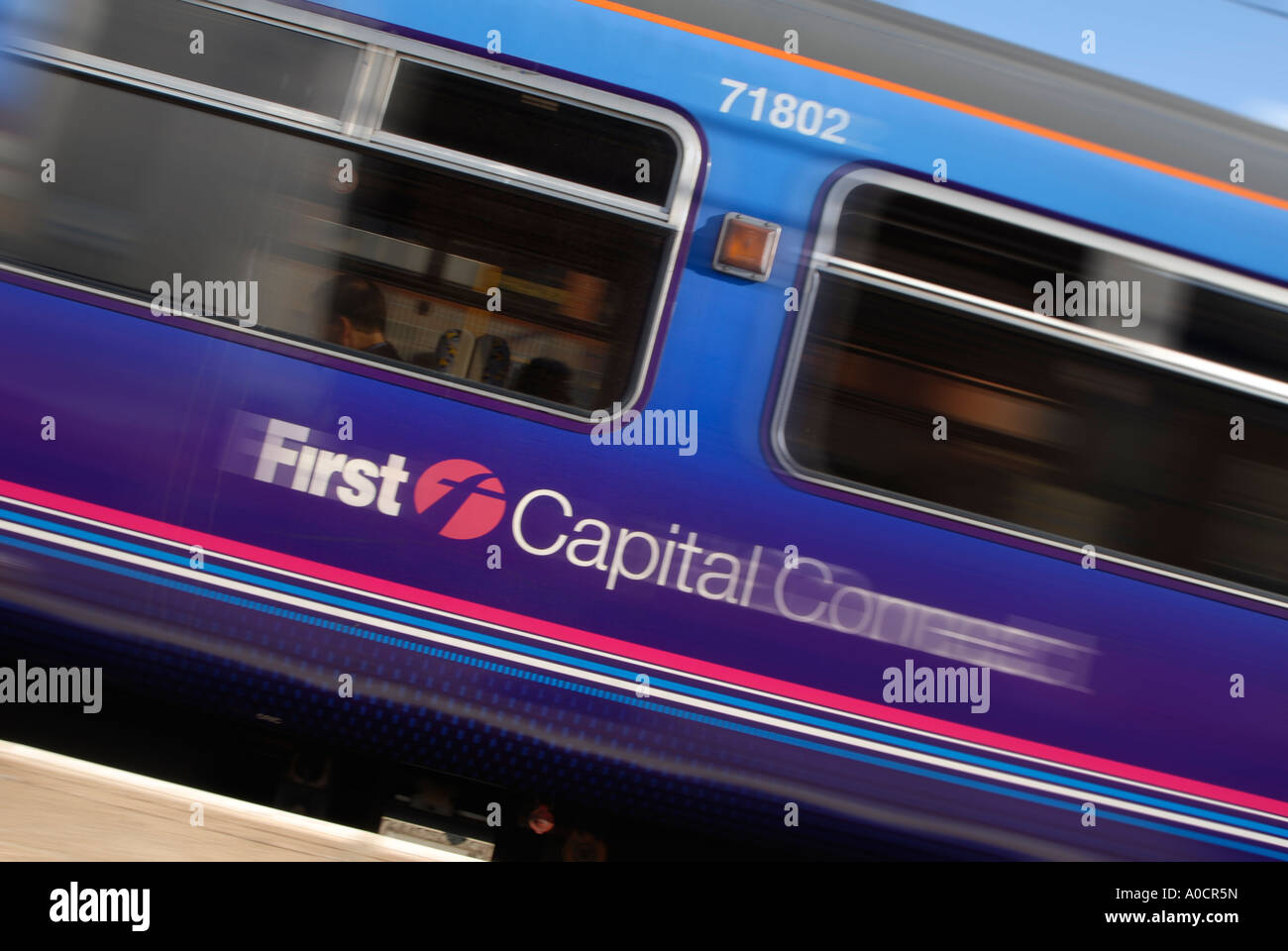 First Capital Connect train passing at speed in the uk Stock Photo - Alamy