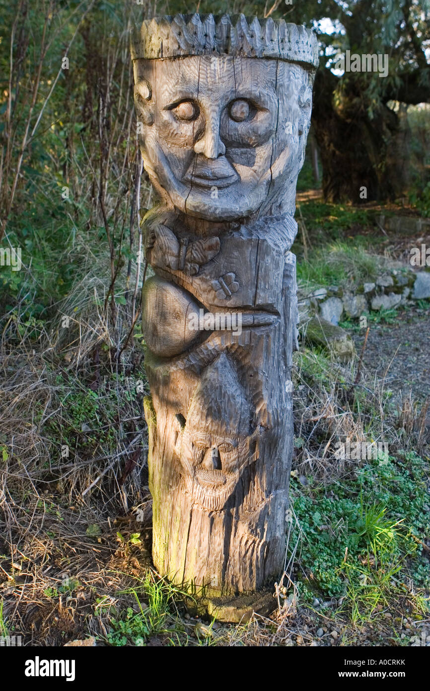 Carved wooden totem pole, poles, posts or pillars, carved with Stock ...