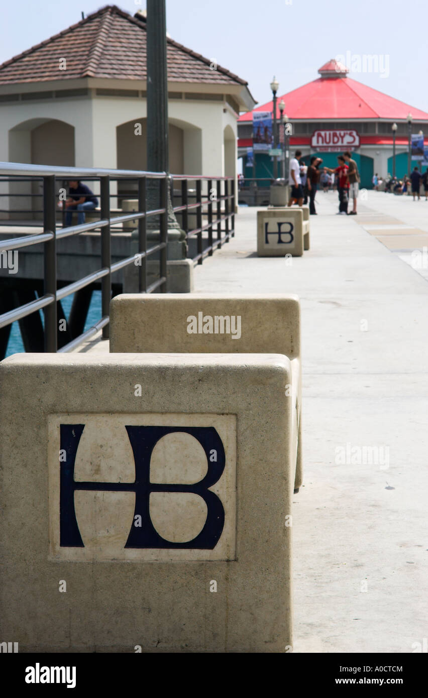 A bench on Huntington pier, Ruby's Surf City Diner visible in the ...