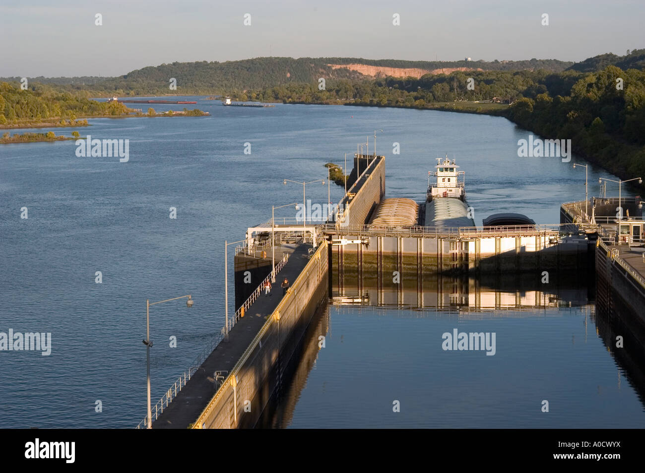 Tugboat pushing barges through the Murray Lock and Dam on the Arkansas ...