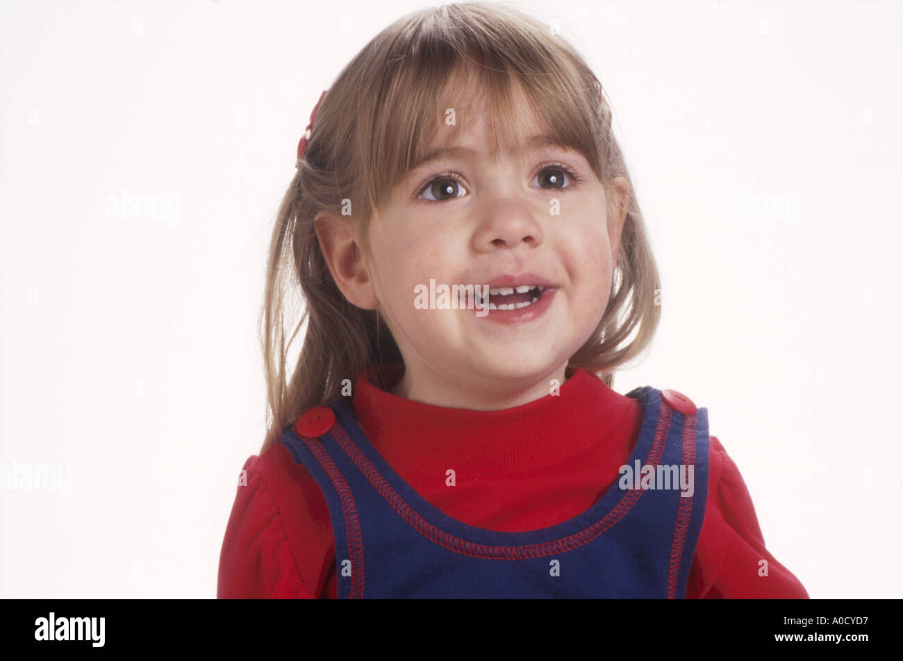 Expressive little girl posing Stock Photo - Alamy