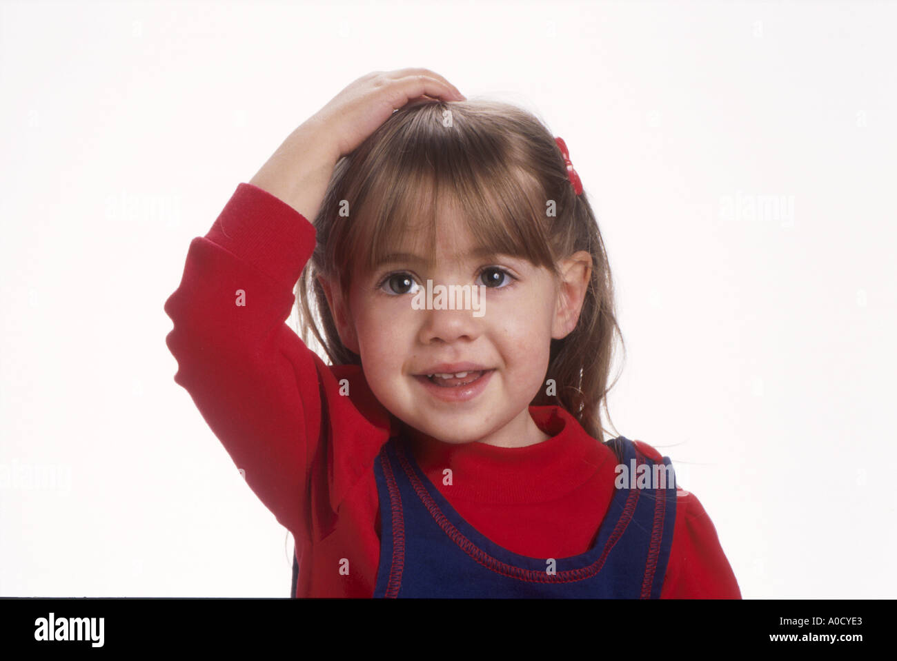 Expressive little girl posing Stock Photo - Alamy