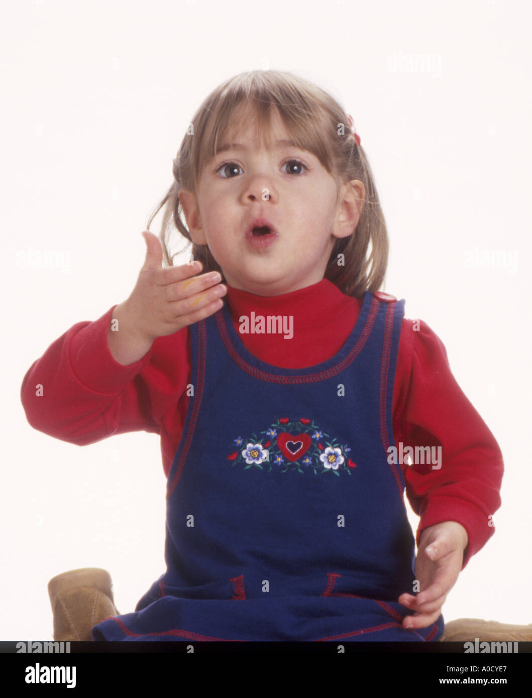 Expressive little girl posing Stock Photo - Alamy