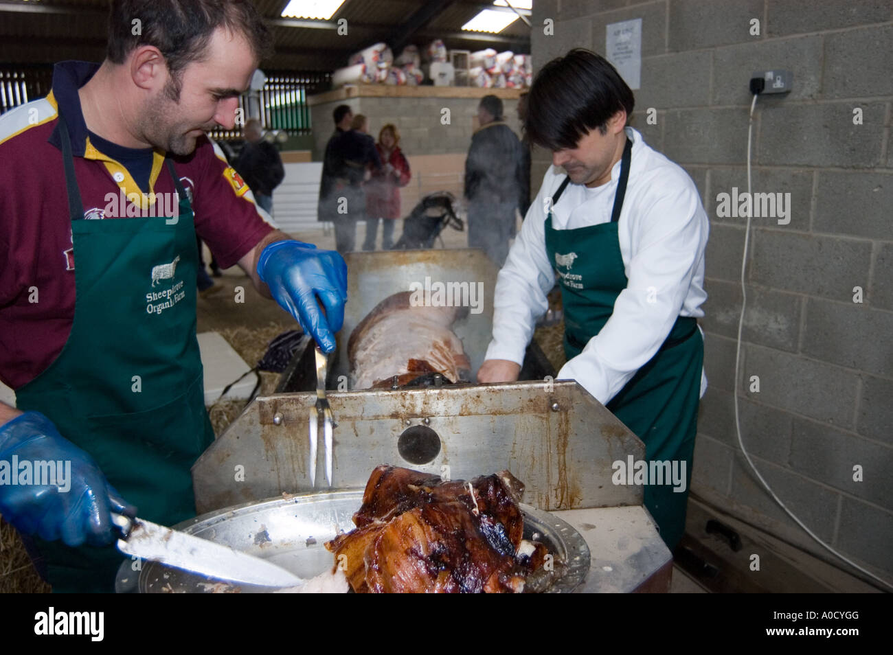 Preparing a hog roast at the Sheepdrove organic farm fayre Stock Photo ...