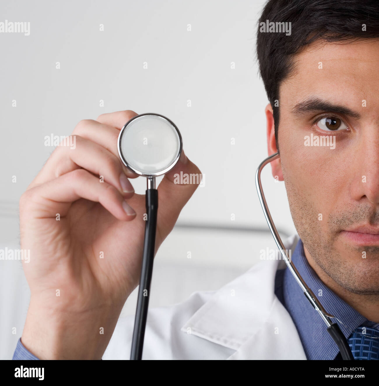 Doctor holding stethoscope Stock Photo - Alamy
