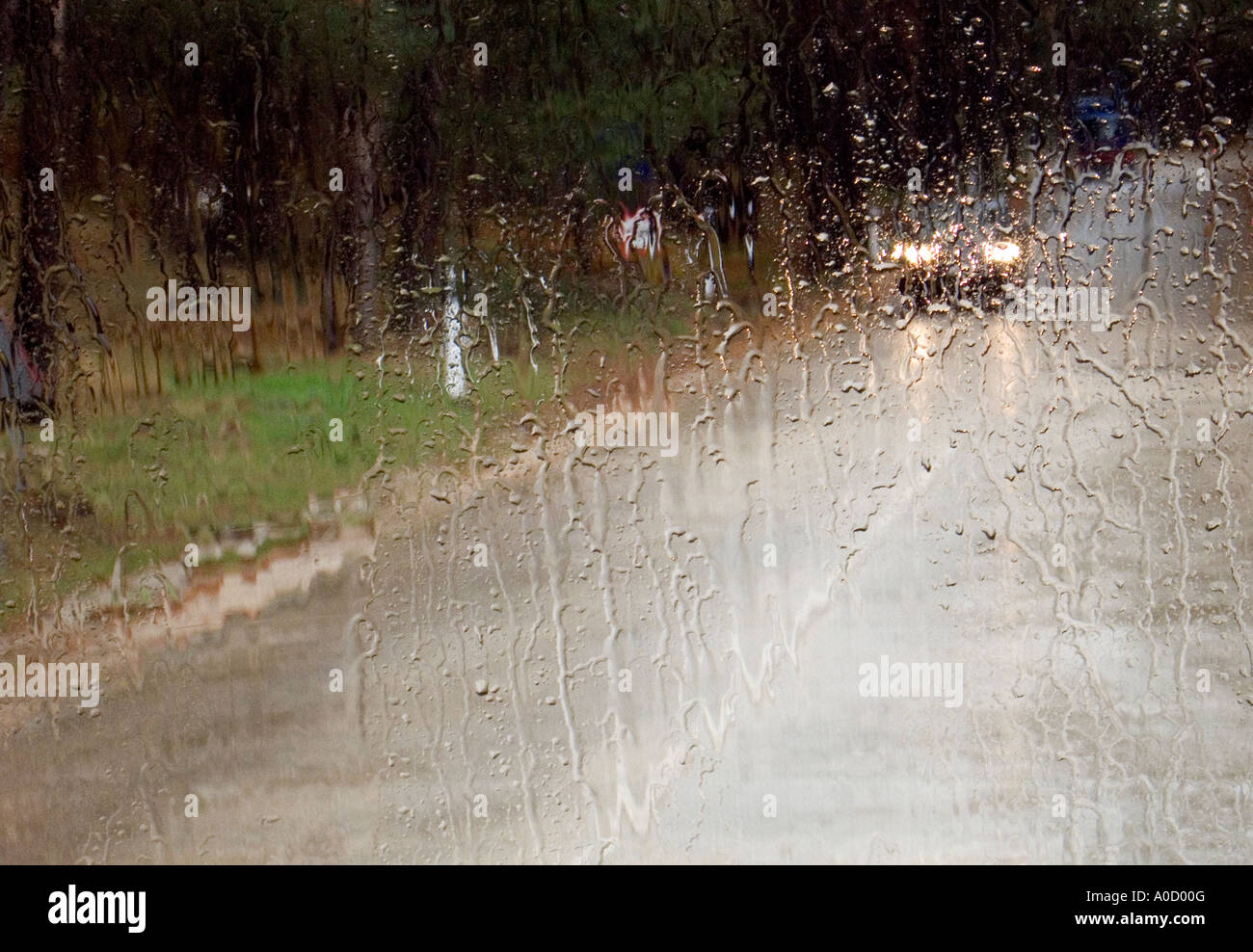 Rainy Road seen through Window Stock Photo - Alamy