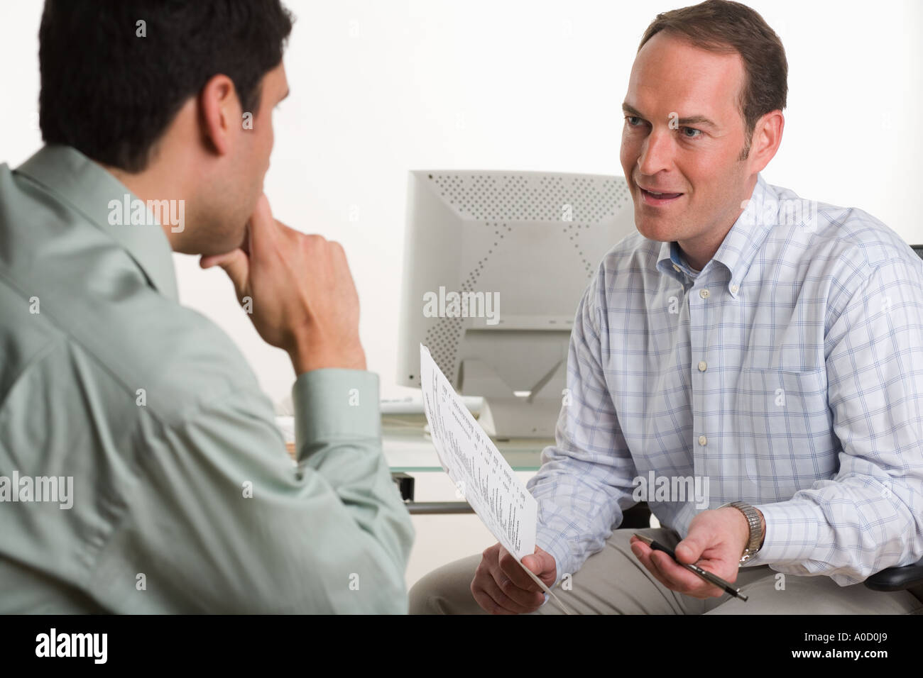 Two men talking Stock Photo - Alamy