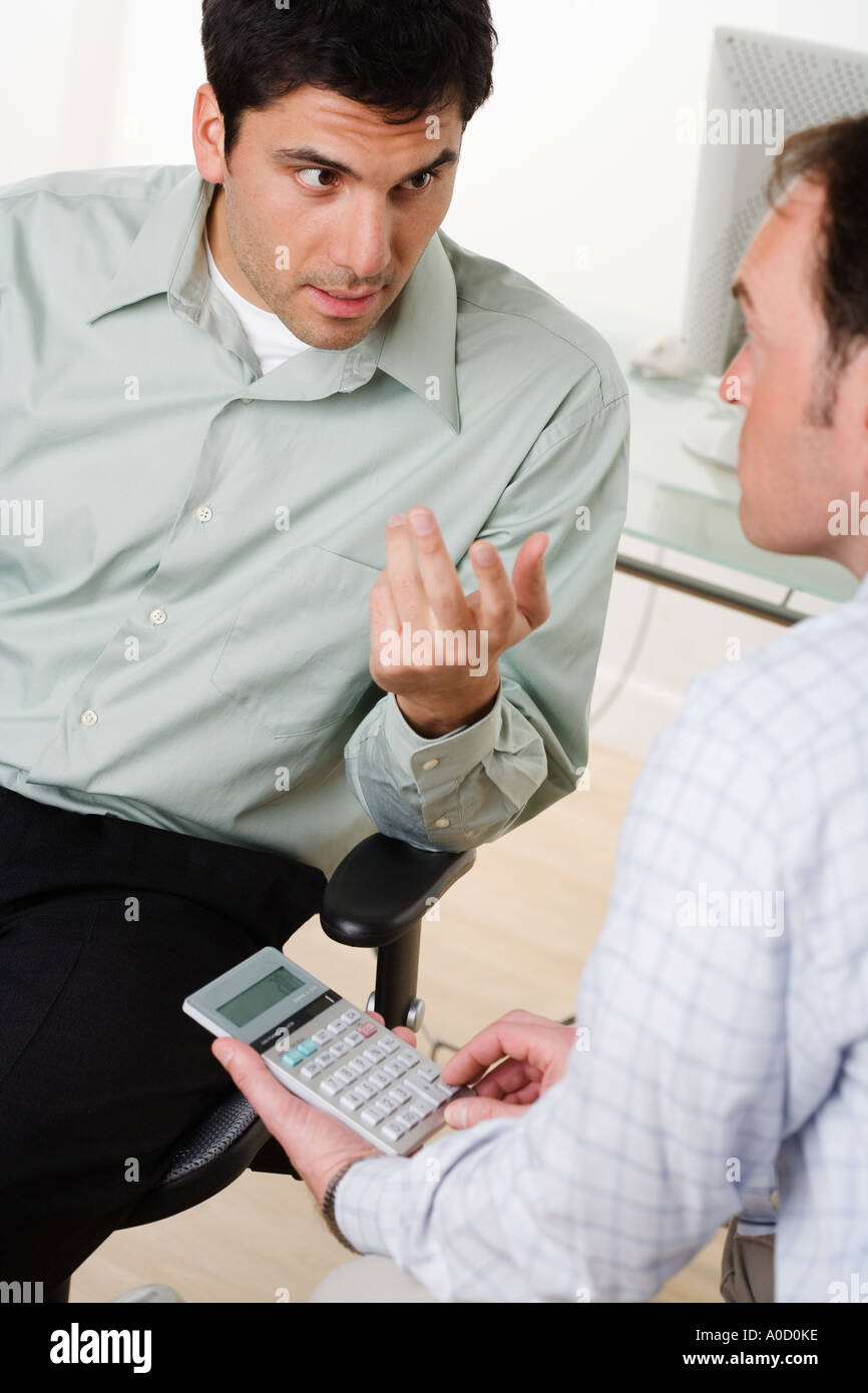 Two men talking Stock Photo - Alamy