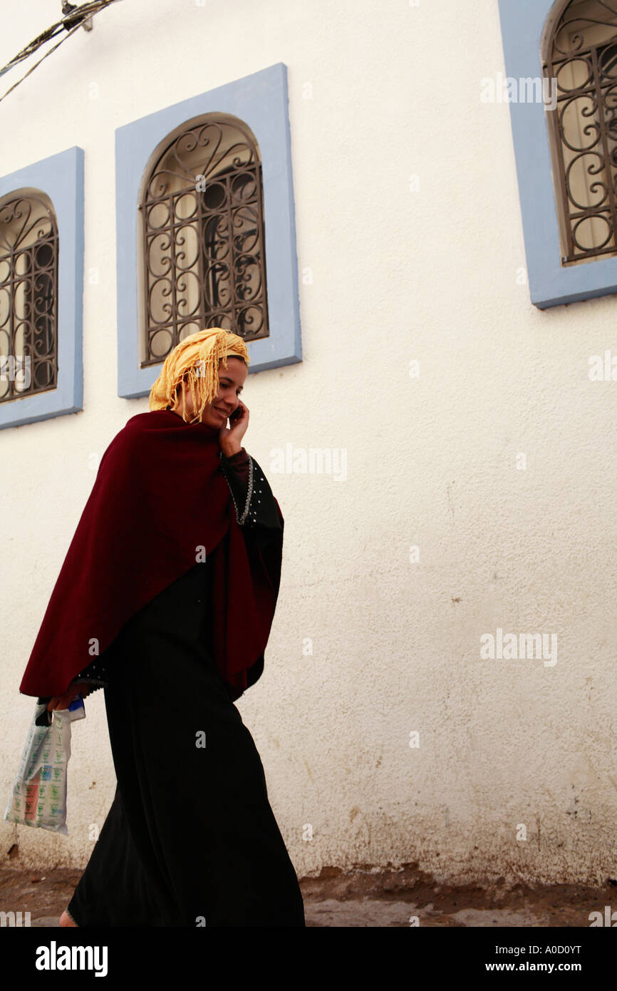 A beautiful Moroccan lady walking through the medina at Azemmour Stock ...