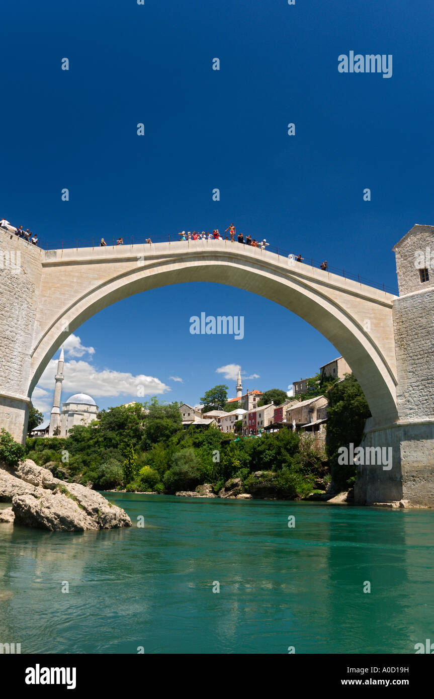 A professional diver prepares for a dive from the new Old Bridge into ...