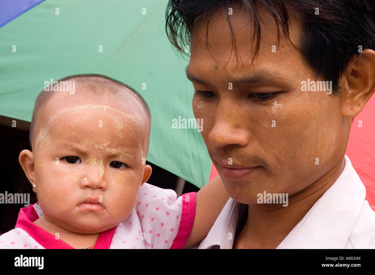 Stock photograph of a father and his small daughter at Bago in Myanmar ...