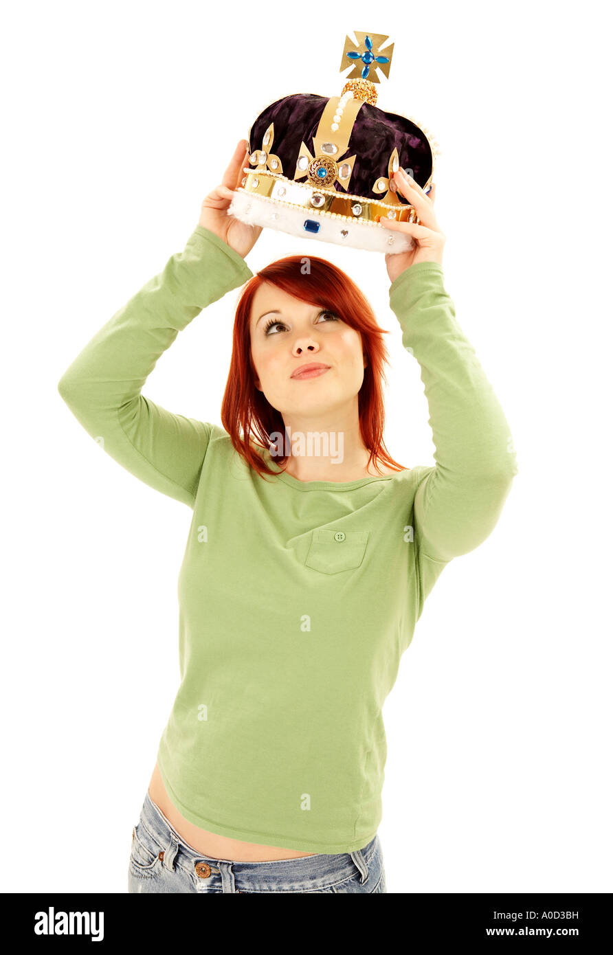 Young woman holding party crown over head Stock Photo - Alamy