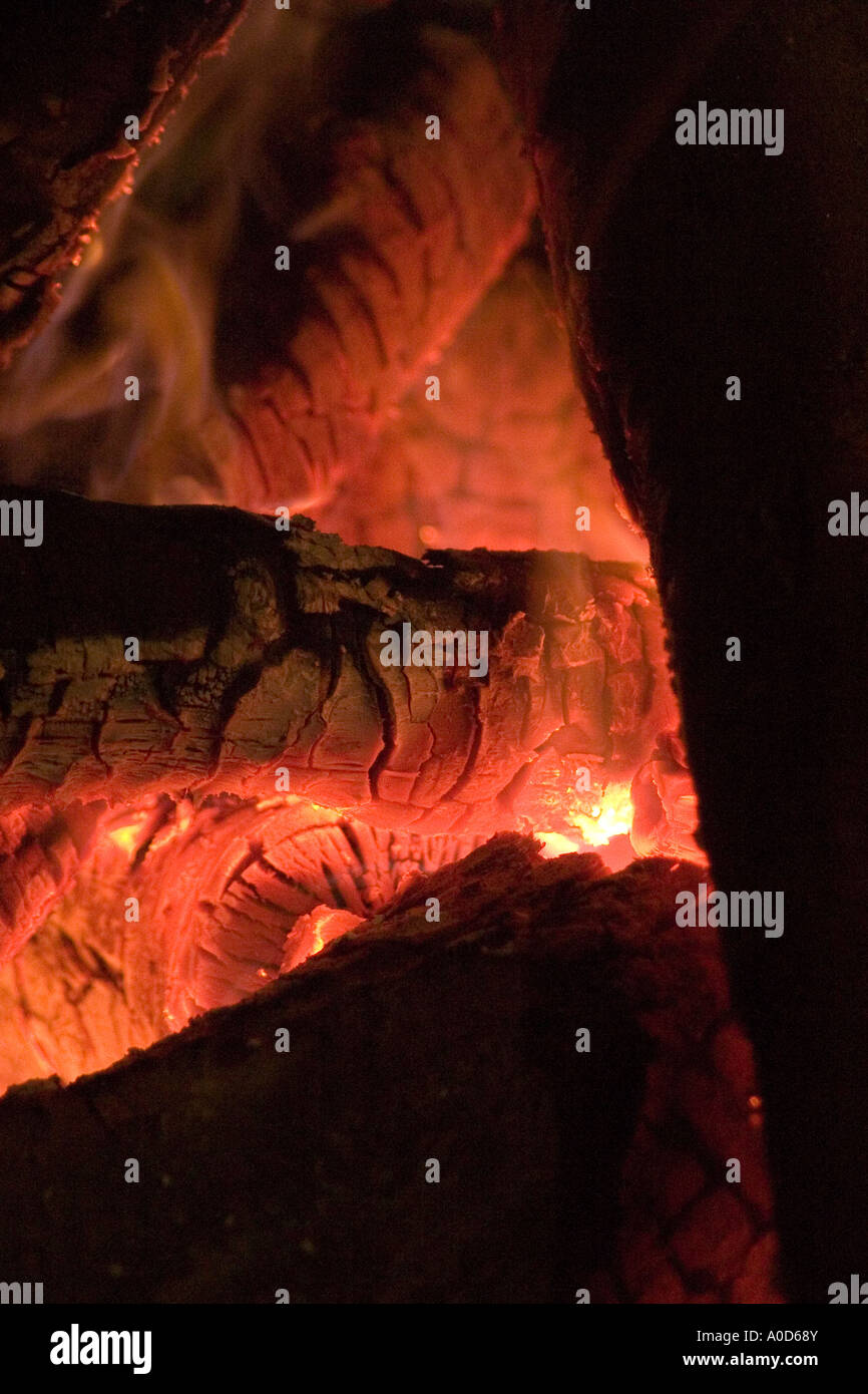 cinders and fire in couldron bbq close up of fire Stock Photo - Alamy
