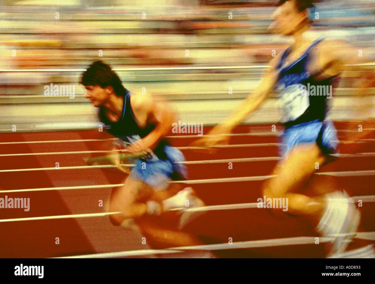 relay race sport running giving passing continue fighting winning track ...