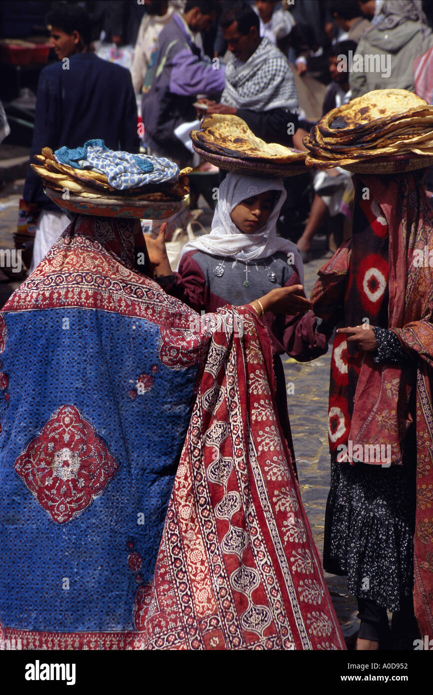 women carrying bread Old Medina Sana a North Yemen Yemen Stock Photo ...
