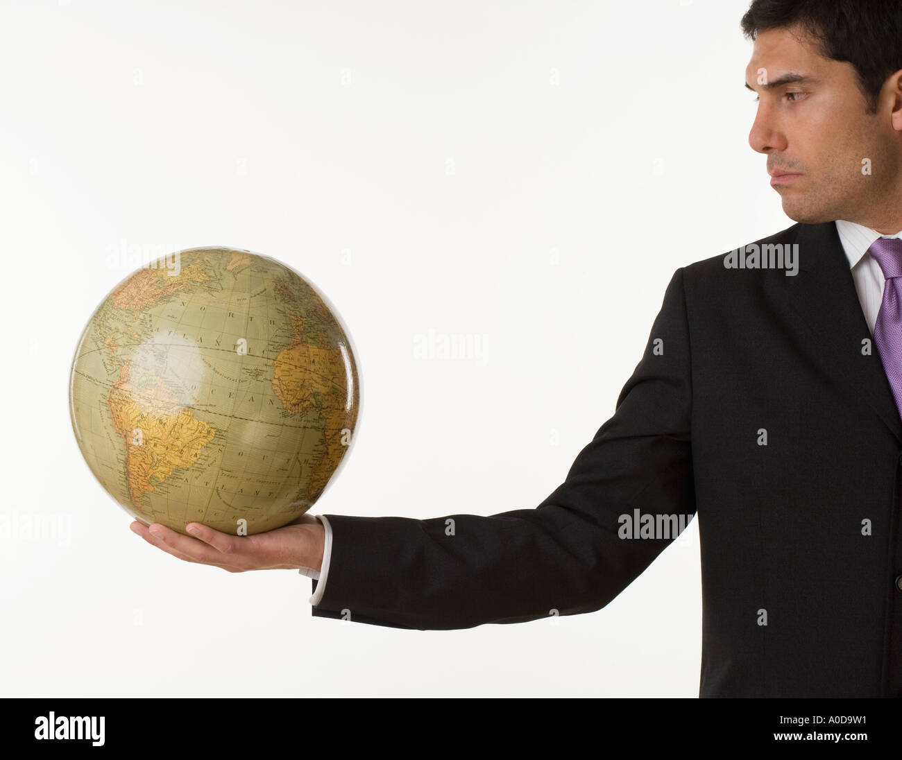 Man holding globe Stock Photo - Alamy