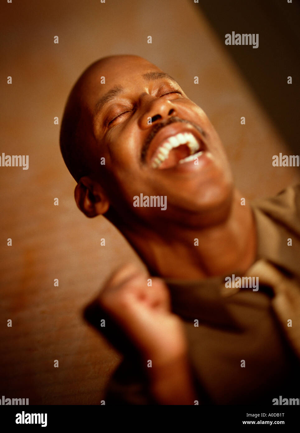 Exec using computer registering excitement and happiness Stock Photo ...