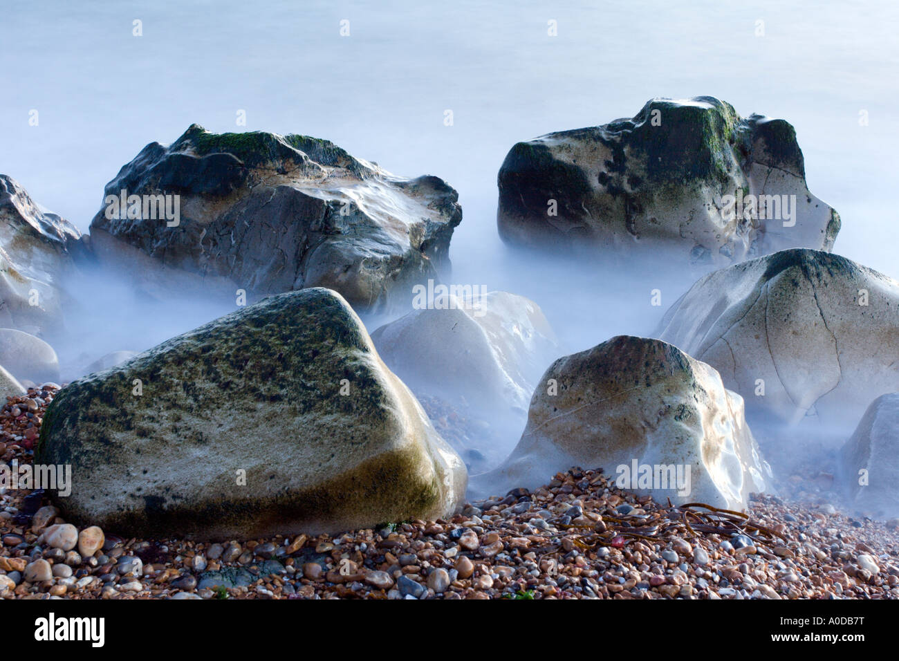 Coastal Boulders in a misty sea Stock Photo - Alamy