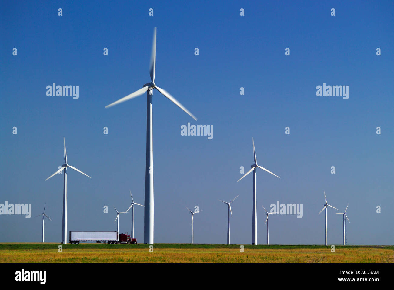 Wind farm with semi truck passing turbines Stock Photo - Alamy