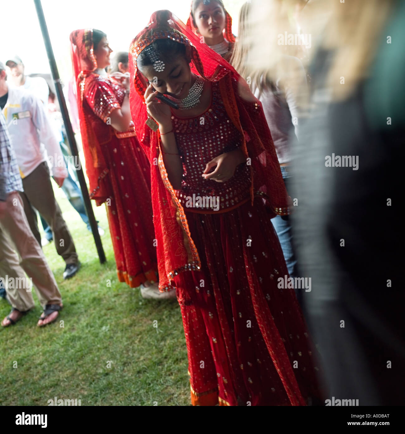 Indian dancers in traditional dress speaks on her cell phone at The ...