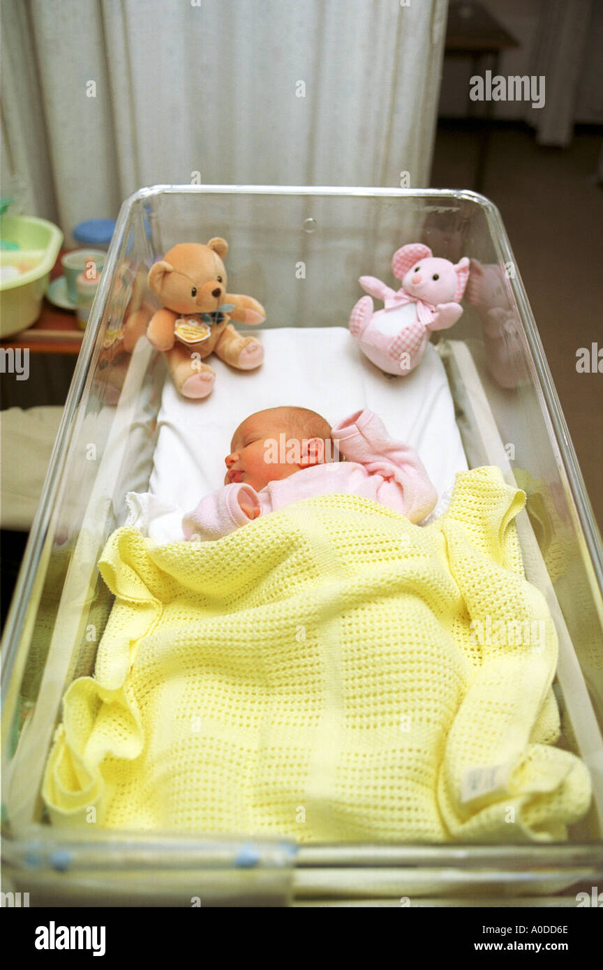 Baby in cot Stock Photo - Alamy